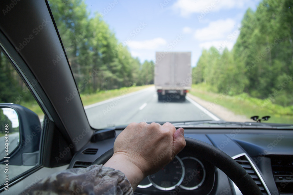 Overtaking a car.A dangerous maneuver on the road.Driving a car. Stock Photo | Adobe Stock