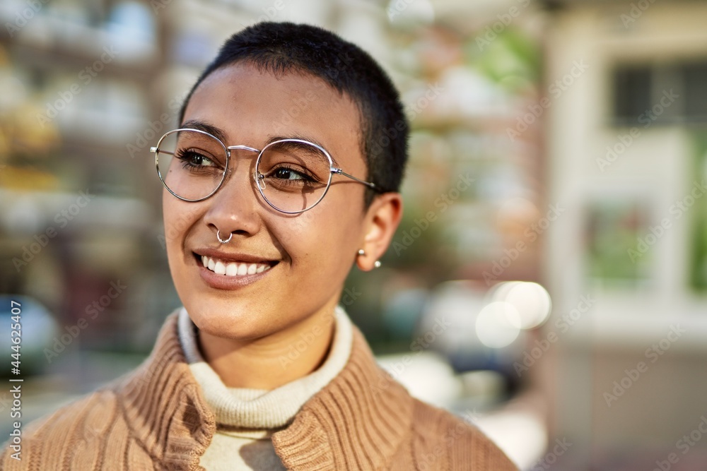 Beautiful hispanic woman with short hair smiling happy outdoors Stock ...