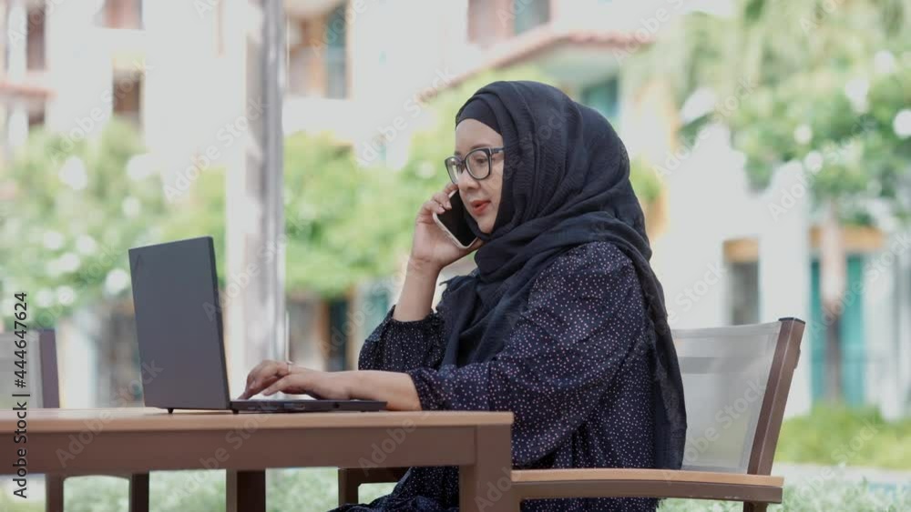 good looking Muslim women sitting outside working according to the ...