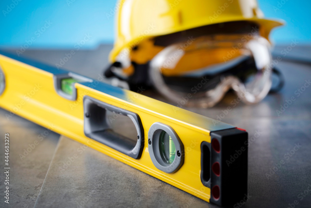 Contractor concept. Tool kit of the contractor: yellow hardhat and ...