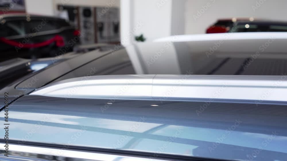 Grey car details with a wind cutter on the top roof spoiler and a ...