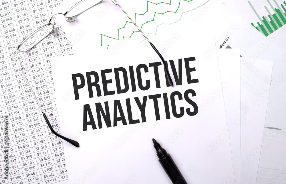 PREDICTIVE ANALYTICS . Conceptual background with chart ,papers, pen ...