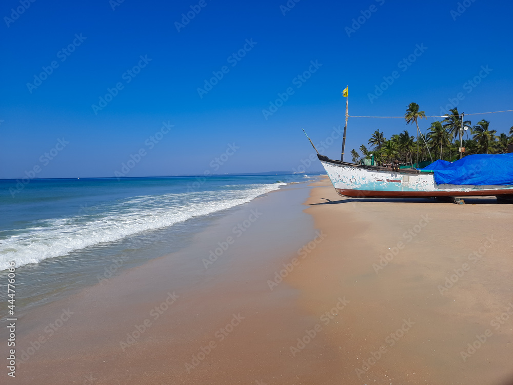 boat on the beach, tropical beach, clean water and blue sky Goa beach ...