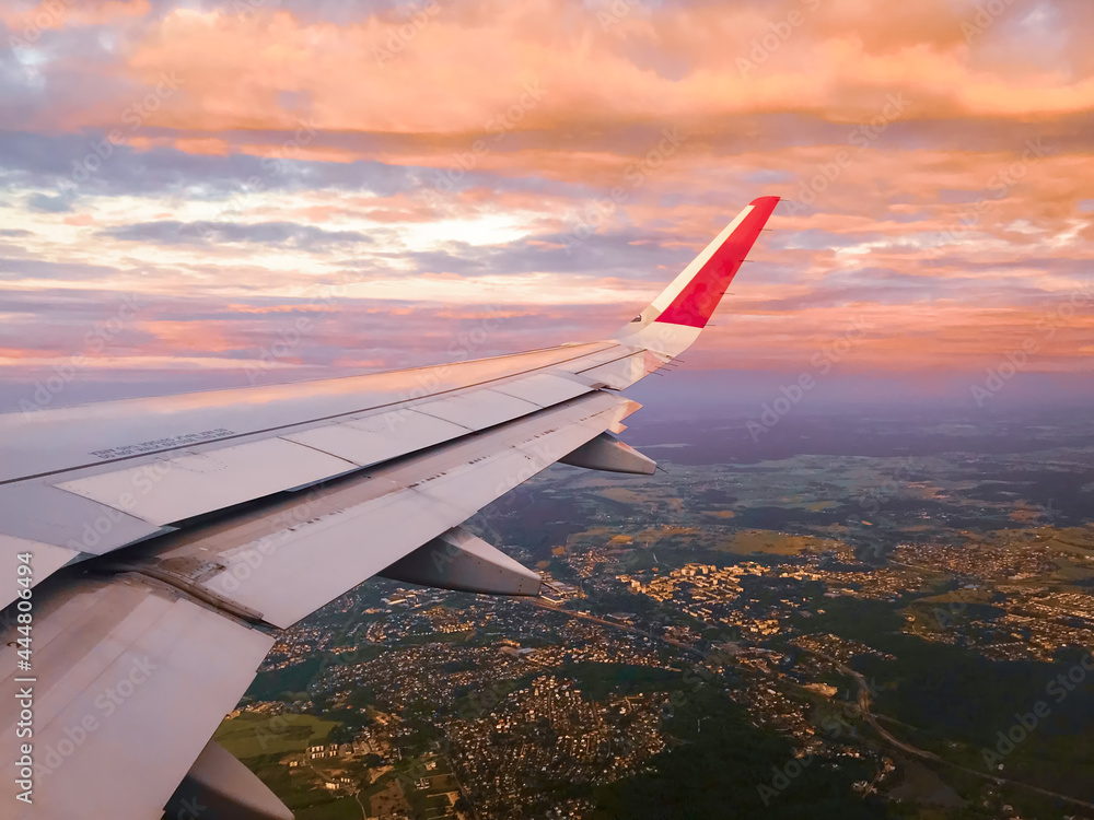 Plane on flight window view with stunning sunset background and ...