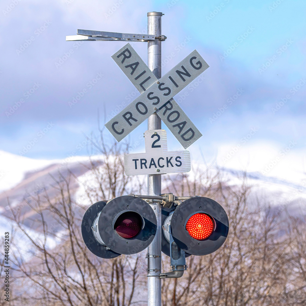 Square Grade crossing signal with red light gate and crossbuck at ...