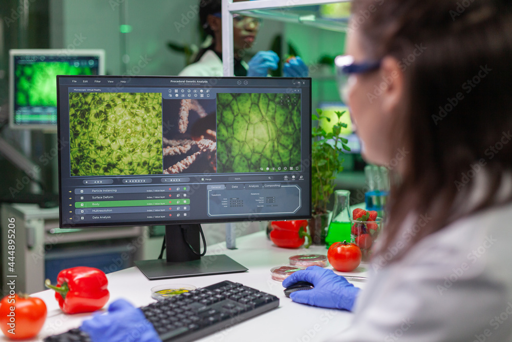 Chemist scientist woman typing biochemistry expertise on computer while ...