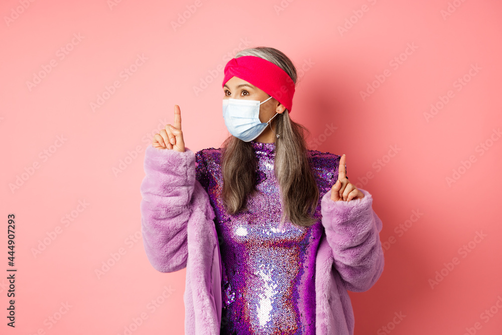 Covid-19, social distancing and fashion concept. Fancy asian senior ...