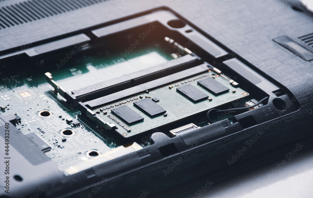 RAM (Random-access memory) in memory slot on the motherboard of laptop ...