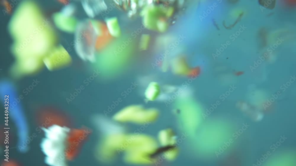 microplastics in water, tiny multicolored plastic bits. global ocean ...
