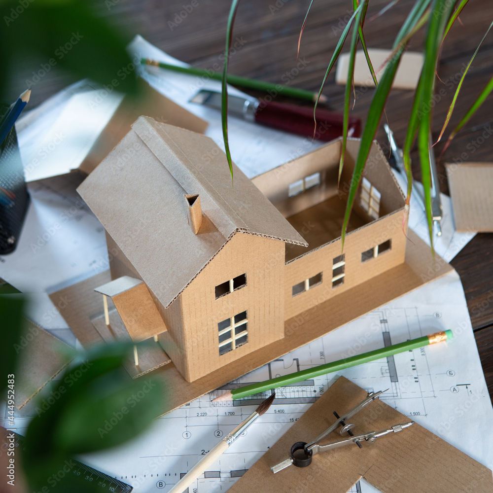 Building new home - design scale model of modern house. Real estate ...