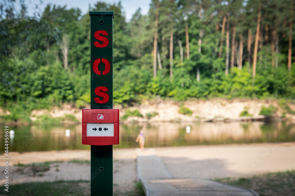 SOS alarm button on the beach to call rescuers Stock Photo | Adobe Stock