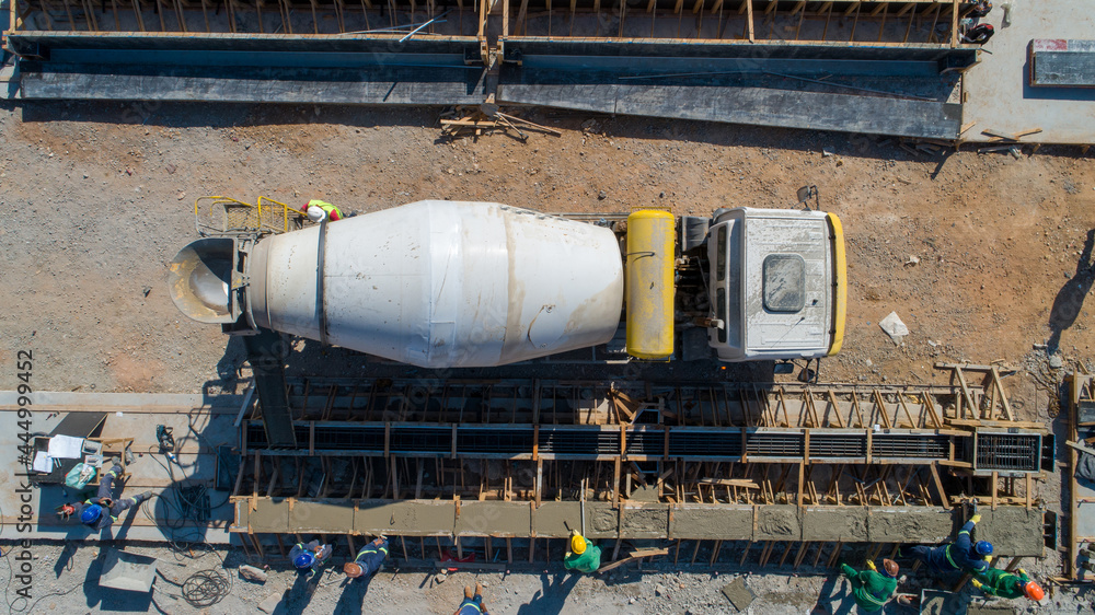 Concrete truck concreting a beam on a construction site. Top view Stock ...