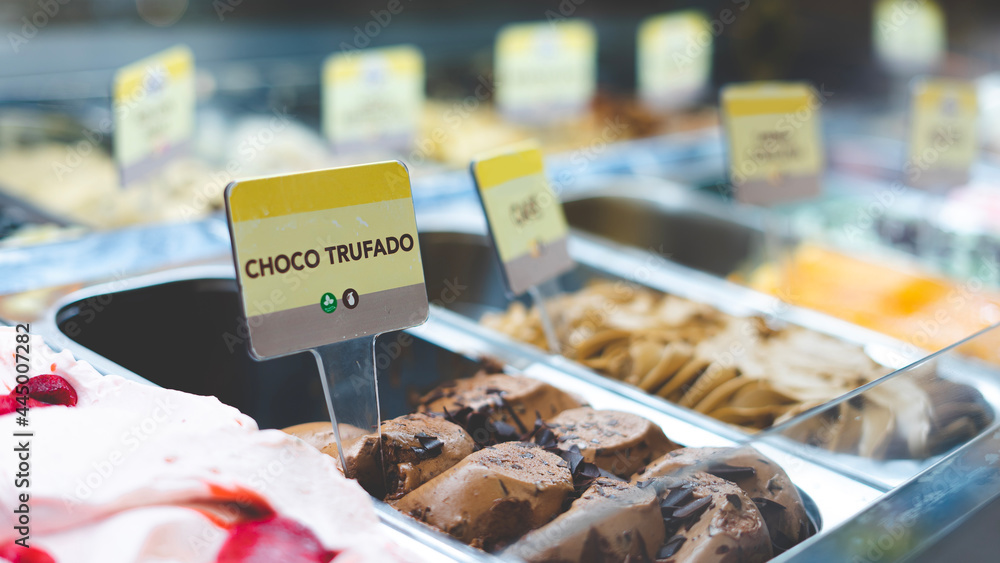 Ice cream display case with various flavors ready to serve Stock Photo ...