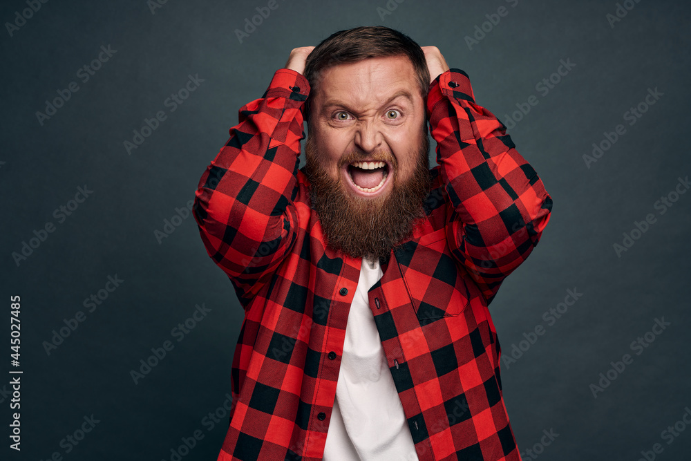 Worried handsome, troubled bearded guy caught cheeting, looking anxious ...