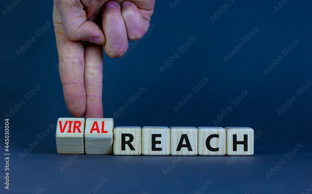 Viral reach symbol. Businessman turns wooden cubes and changes words ...