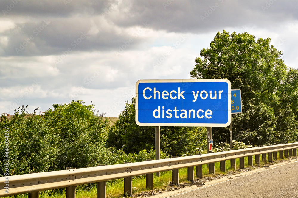 Safety sign on a motorway advising drivers to check the distance ...