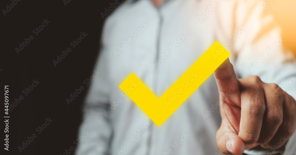 Businessman hand marking approved yellow check mark, Checklist concept ...