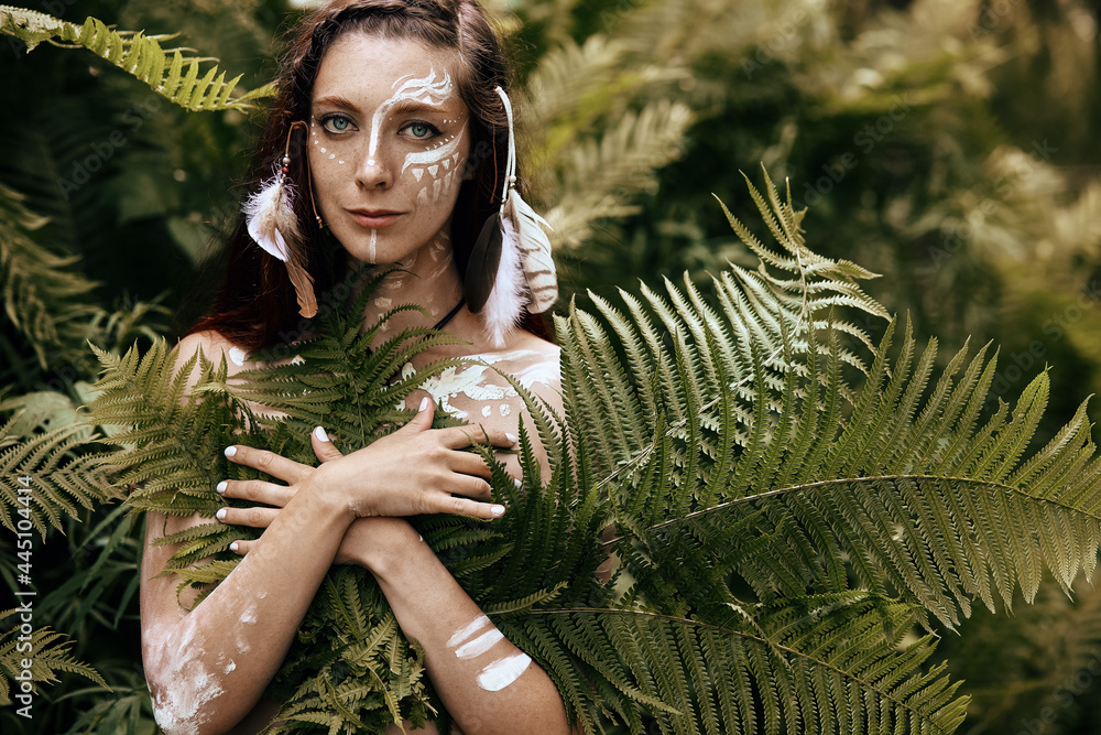 Modern mystical LGBT+ witch with bright white patterns on her face and ...