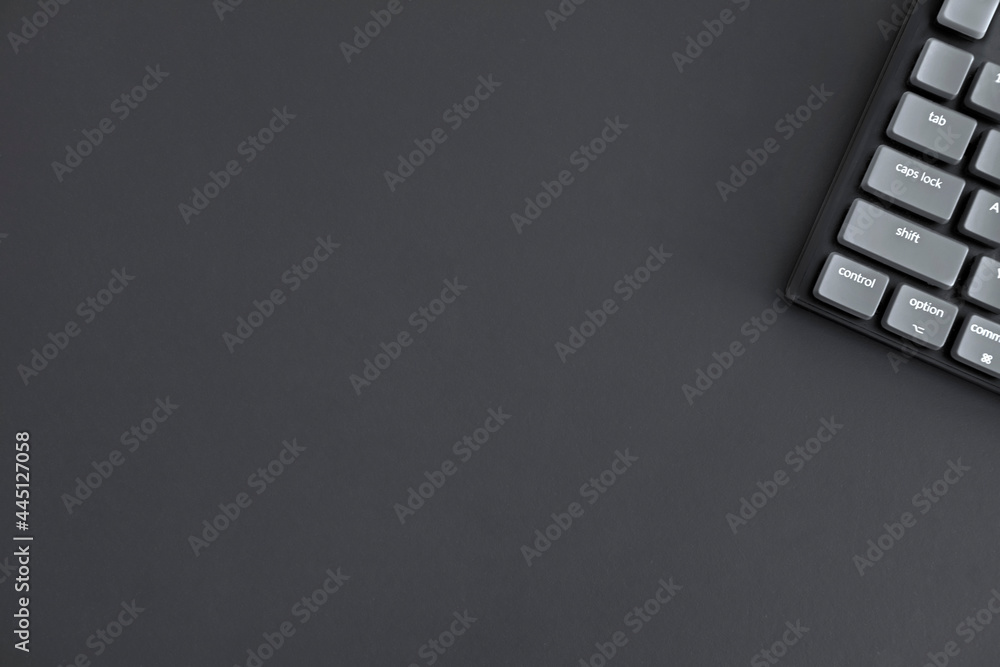 Blank dark grey matt workplace on office desk with computer keyboard on ...