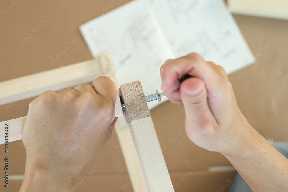 Assembly wooden furniture at home using screw allen Stock Photo | Adobe ...