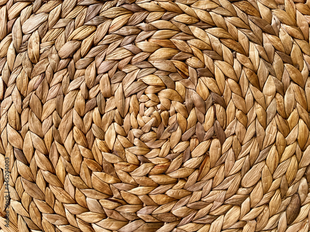 Round braided natural straw table mat texture as a background. Full ...