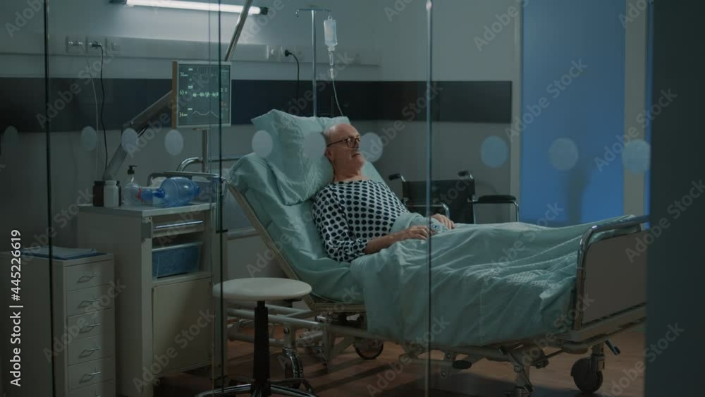 Old patient with breathing problems sitting in hospital ward for ...