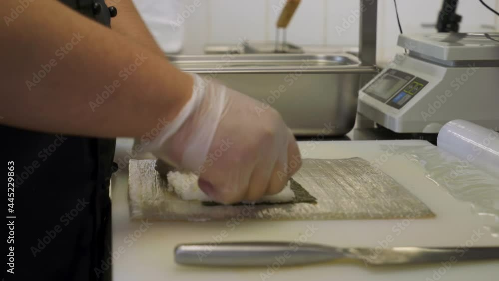 Japanese food Industry. A Sushi Chef is producing Japanese food by ...