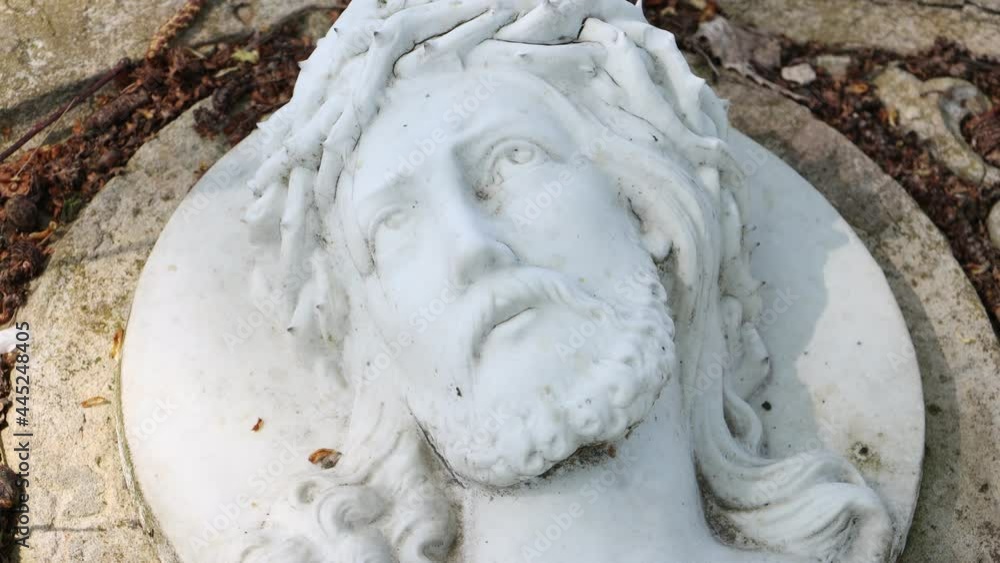 White statue of the head of Jesus Christ with sunlight through the ...