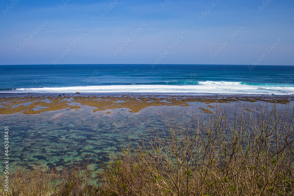 Aerial view of Gunung Payung Beach at low tide, Bali, Indonesia ...