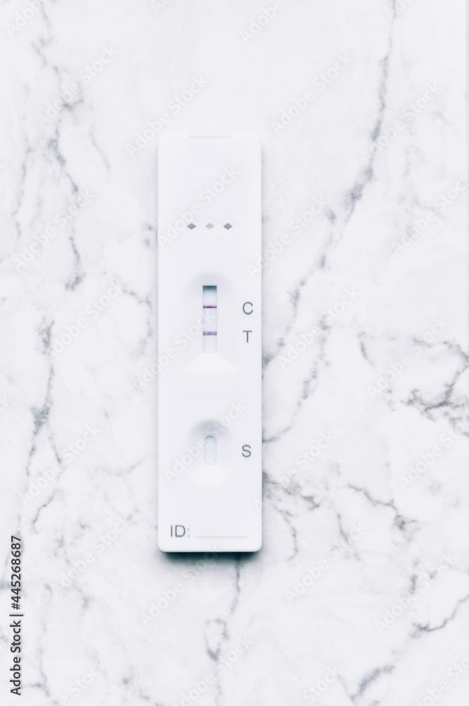 Positive rapid lateral flow coronavirus test Stock Photo | Adobe Stock