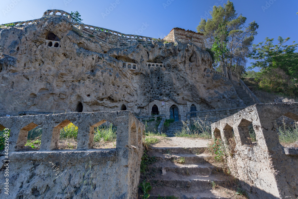 Civic medieval village. Medieval monastery built into the rock of the ...