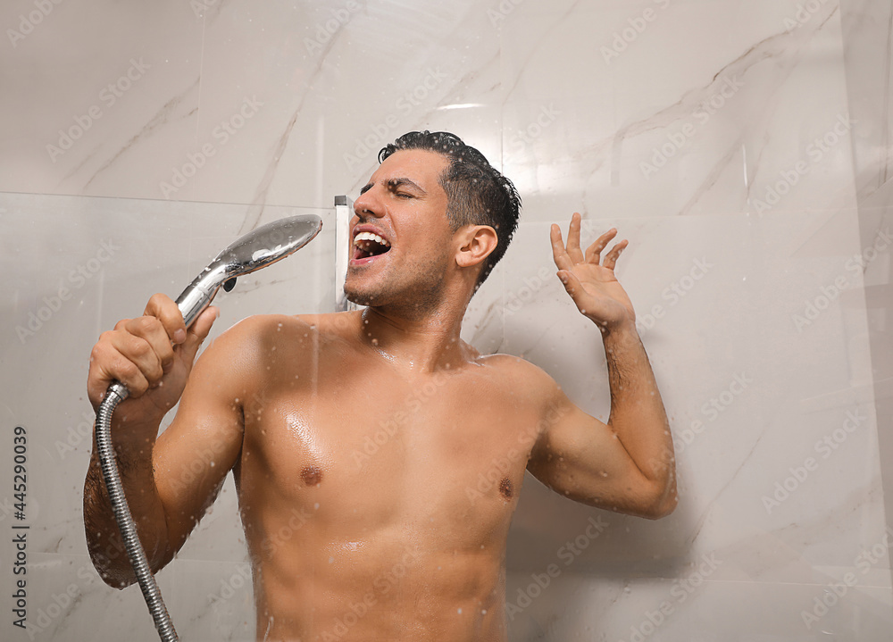 Handsome man singing while taking shower at home Stock Photo | Adobe Stock