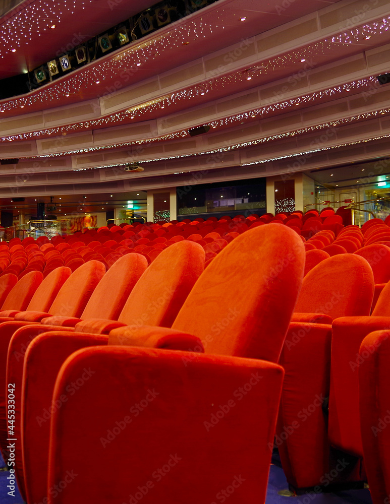 Show Lounge or large theatre with stage and seating in red and blue on ...