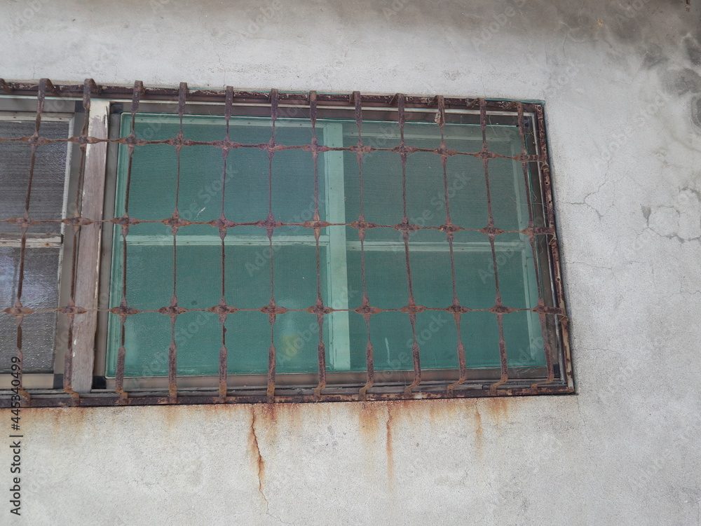 vintage window with rusty bars on the aged wall design for ancient ...