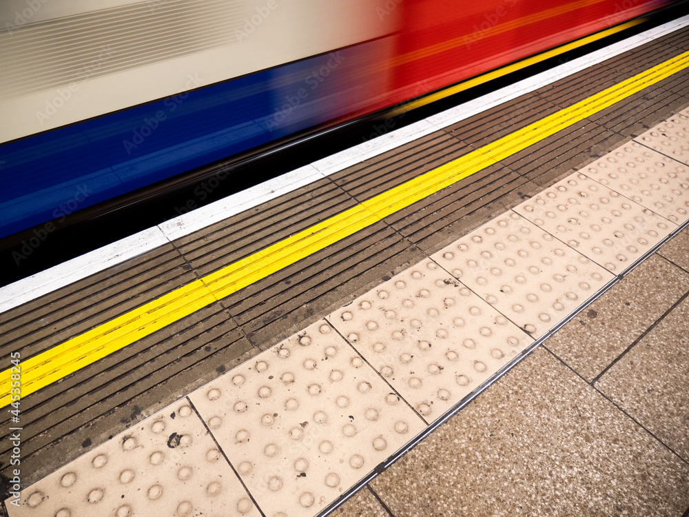 London Underground. A Central Line tube train passing the platform at ...