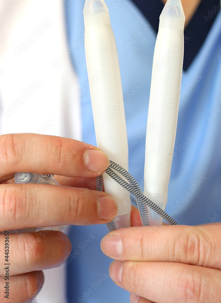 Doctor andrologist holding hydraulic penile prosthesis for ...