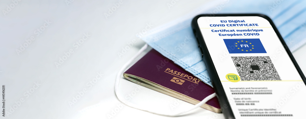 French EU Digital COVID Certificate with the QR code on the screen of a ...