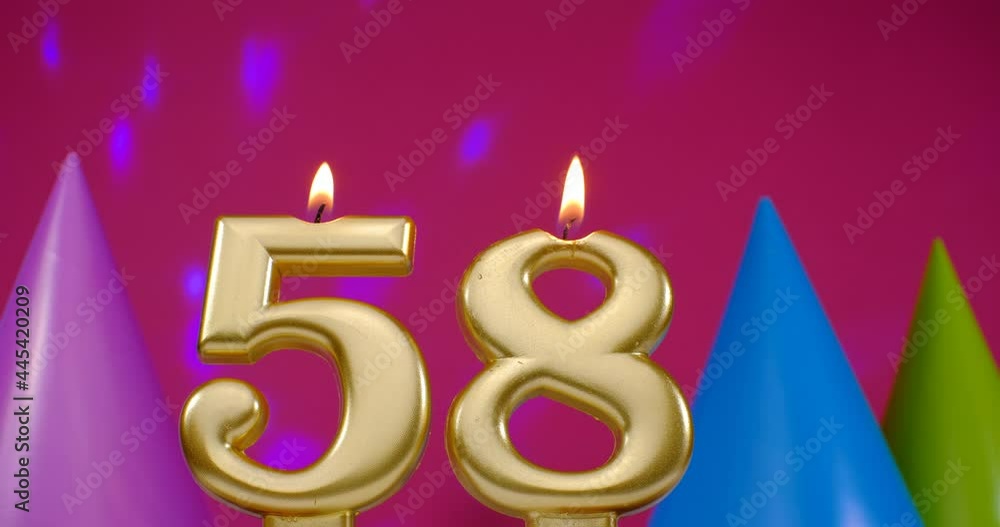 Burning birthday cake candle number 58. Happy Birthday background ...