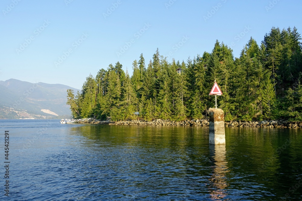 A low tide view of a starboard hand day beacon, which has a red ...