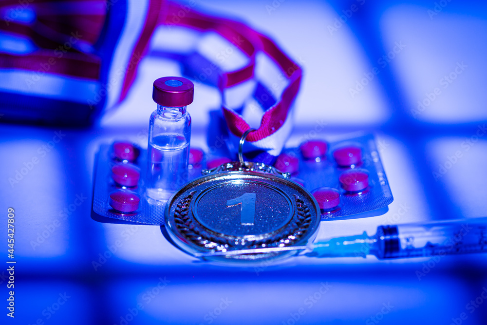 Champion gold medal, syringe with doping substance, pill tablet and ...