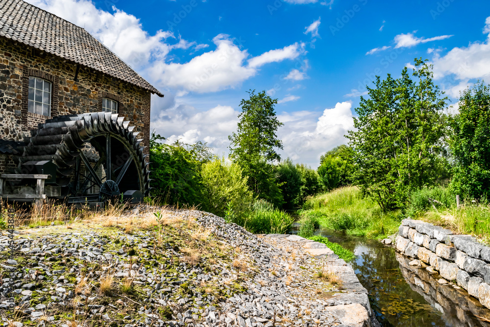 Beautiful summer rustic countryside landscape with a water mill and an ...