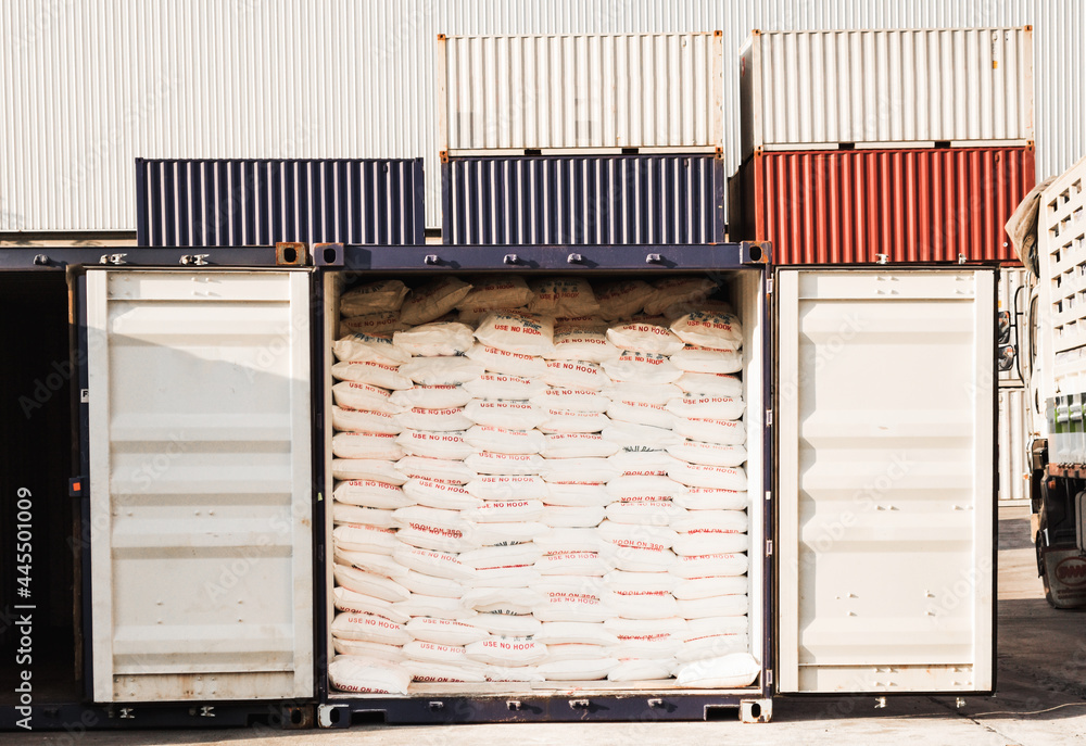 Rice bags stuffed in containers at warehouse for export. Stock Photo ...