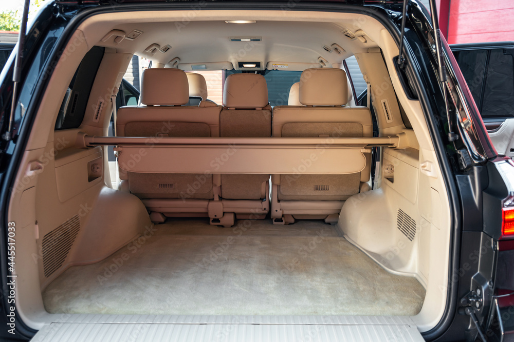 Rear view open car trunk. Large empty flat flor crossover car trunk ...