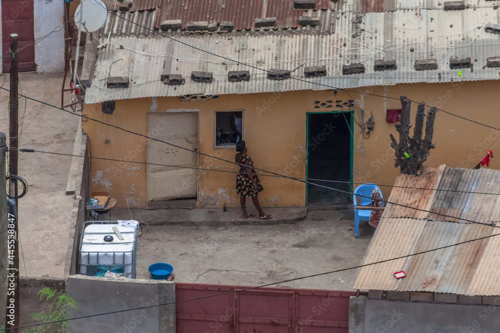 Aerial view of a african woman talking with other woman on windows ...