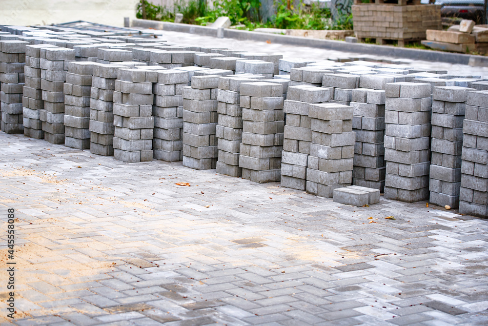 Stack of concrete paving slabs in the pedestrian zone. Repair pavement ...