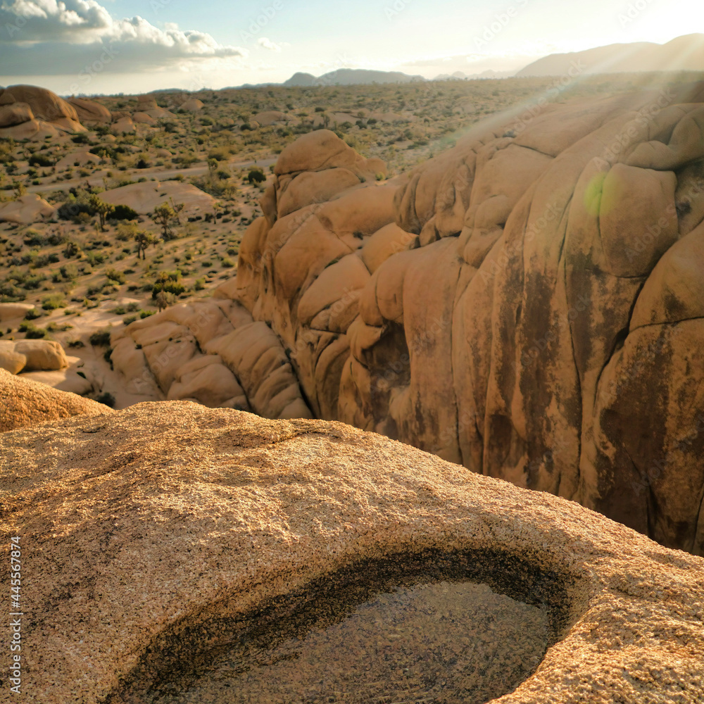 Square frame Holes from erosion of rocks with puddle of water at Joshua ...