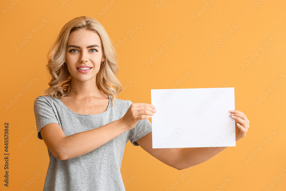 Beautiful young woman with blank paper sheet on color background Stock ...
