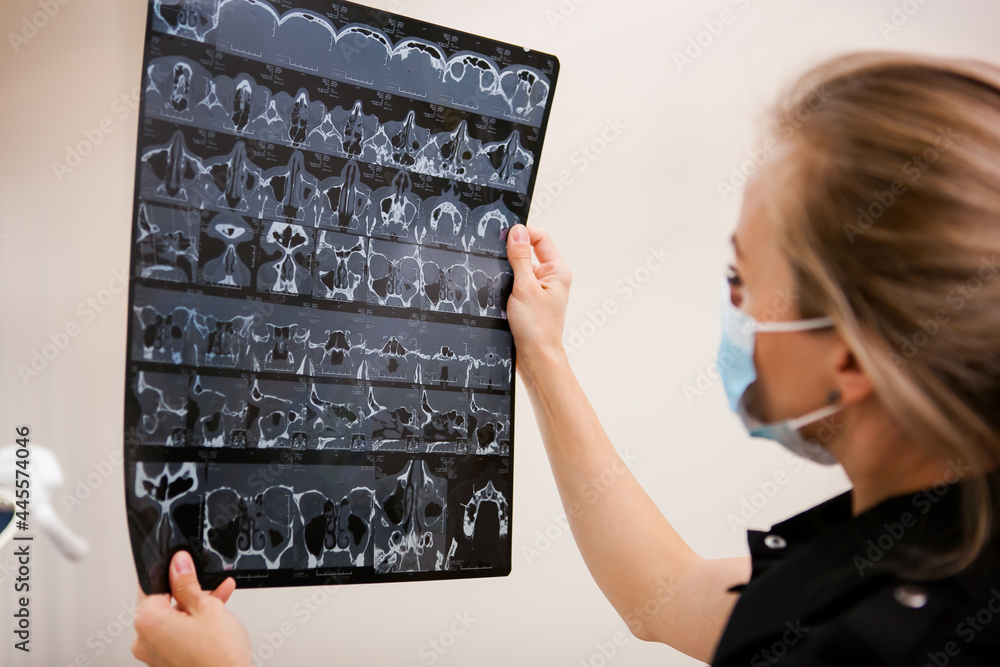 doctor a white woman with long blond hair in a black uniform holds an ...