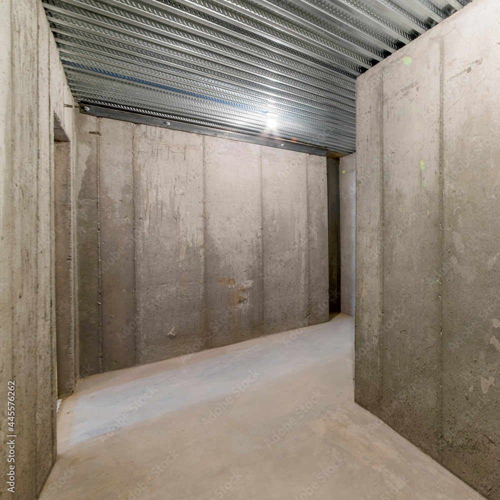 Square frame Unfinished empty cold storage room in a basement of a ...