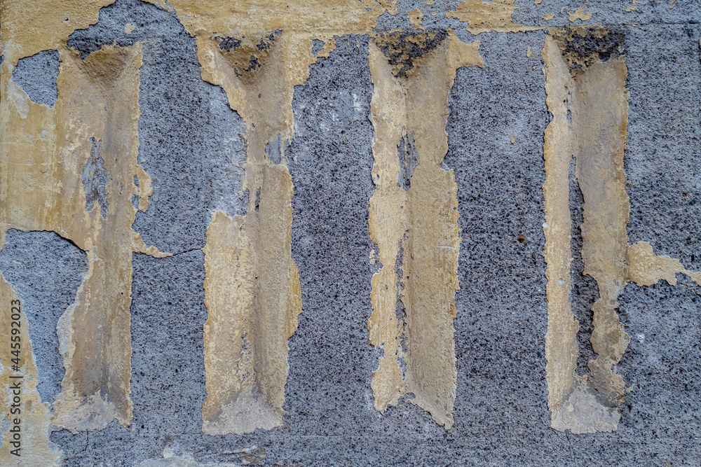 damaged weathered concrete coating of fainted paint of building wall ...